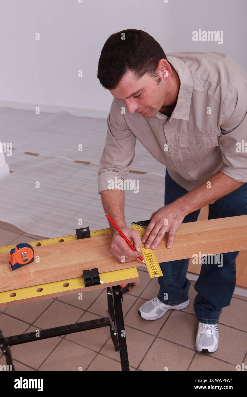 carpenter taking measurements Stock Photo - Alamy