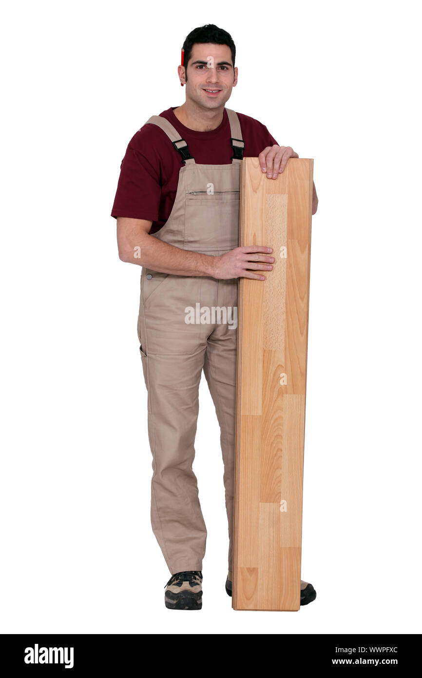 carpenter posing with planks Stock Photo - Alamy
