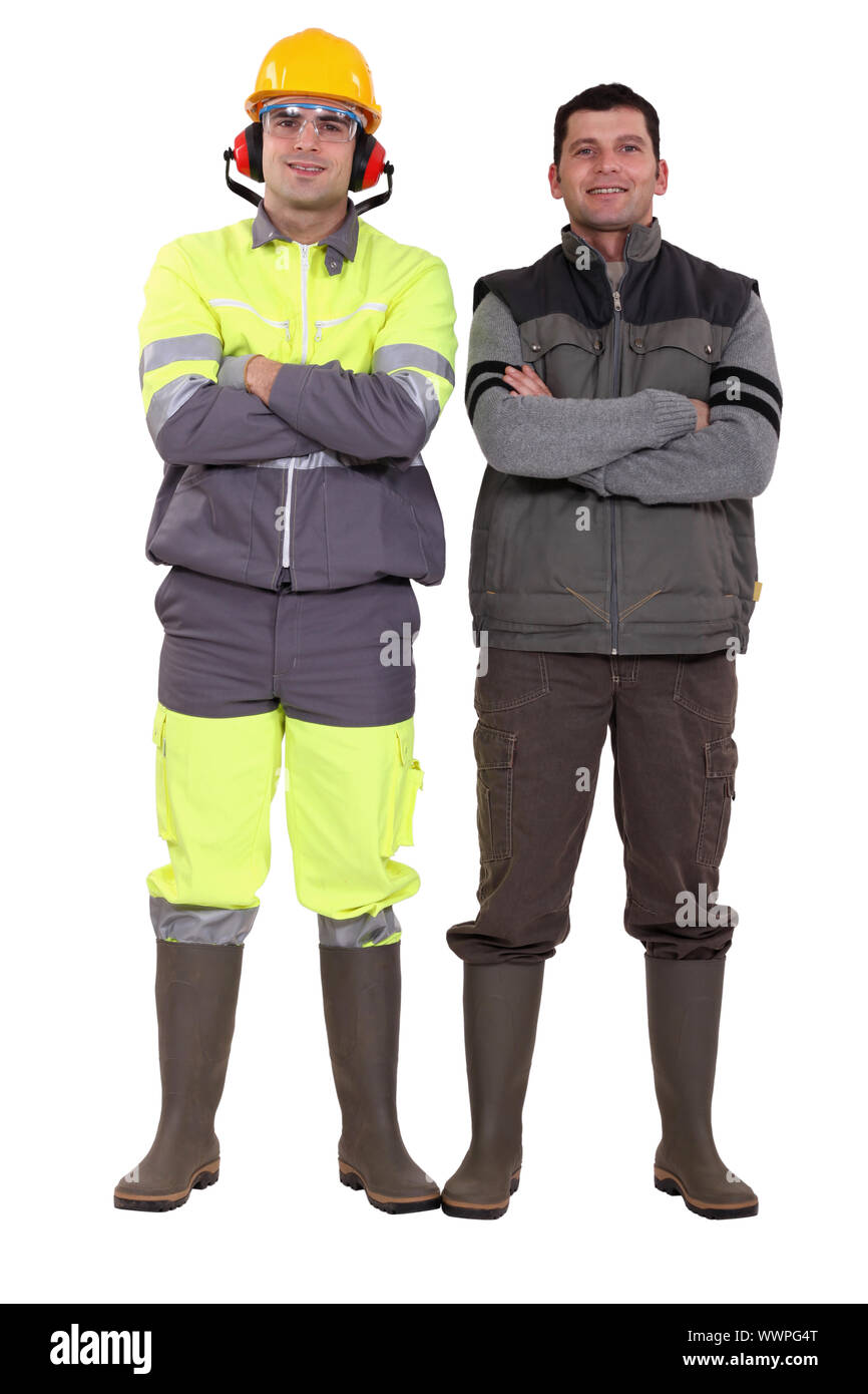 duo of craftsmen posing cross-armed Stock Photo - Alamy