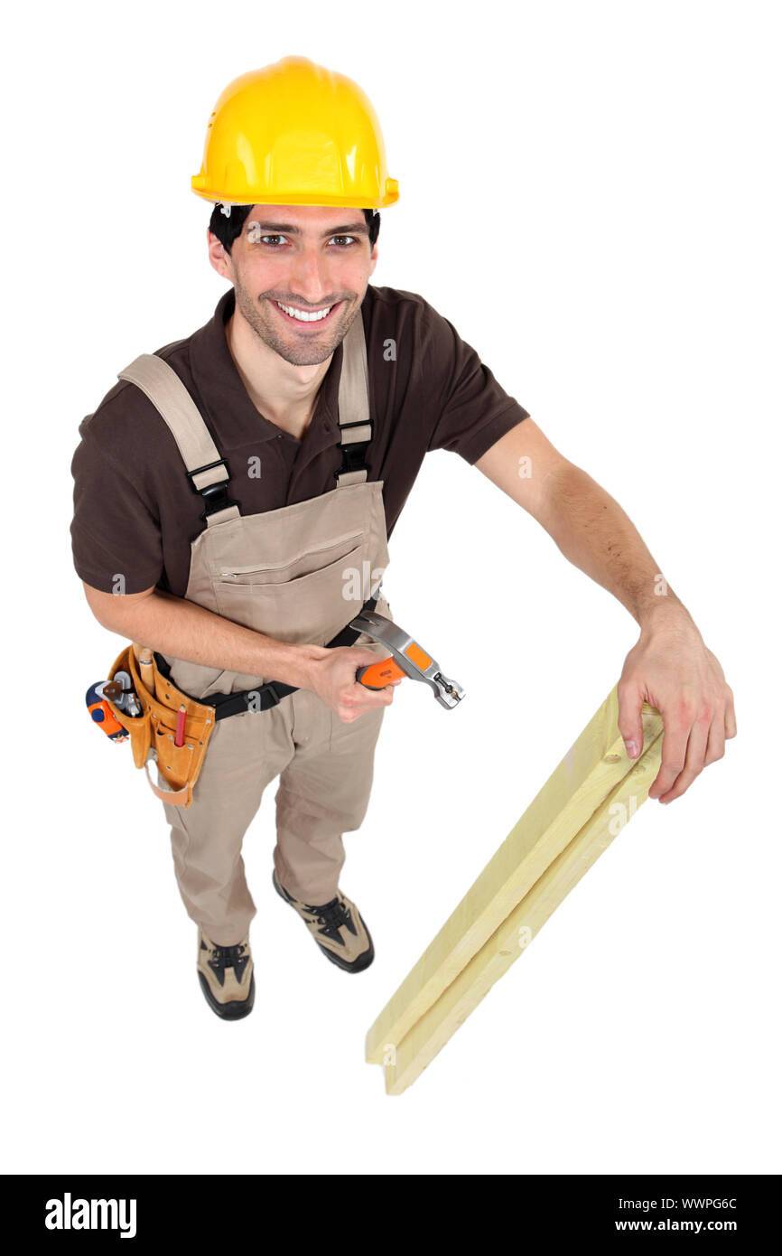 Happy carpenter, studio shot Stock Photo - Alamy