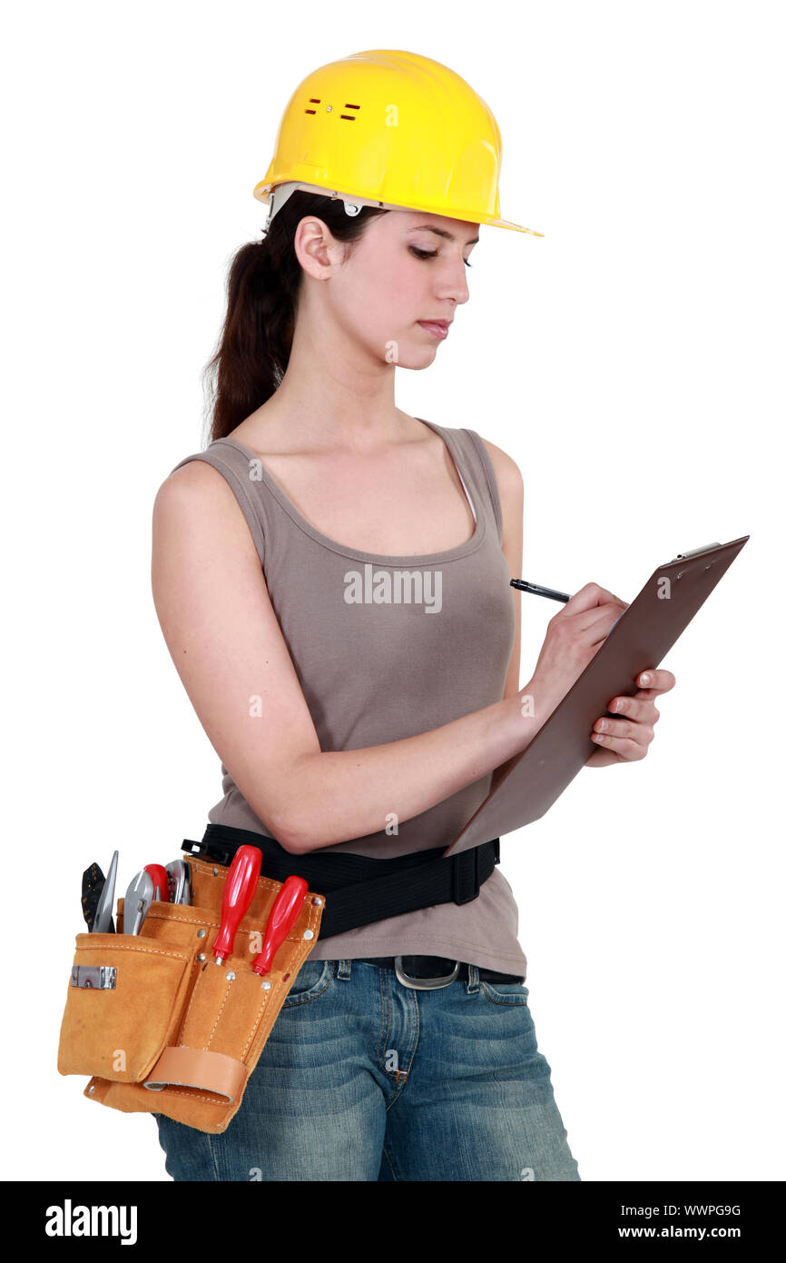 Female builder holding clipboard Stock Photo - Alamy
