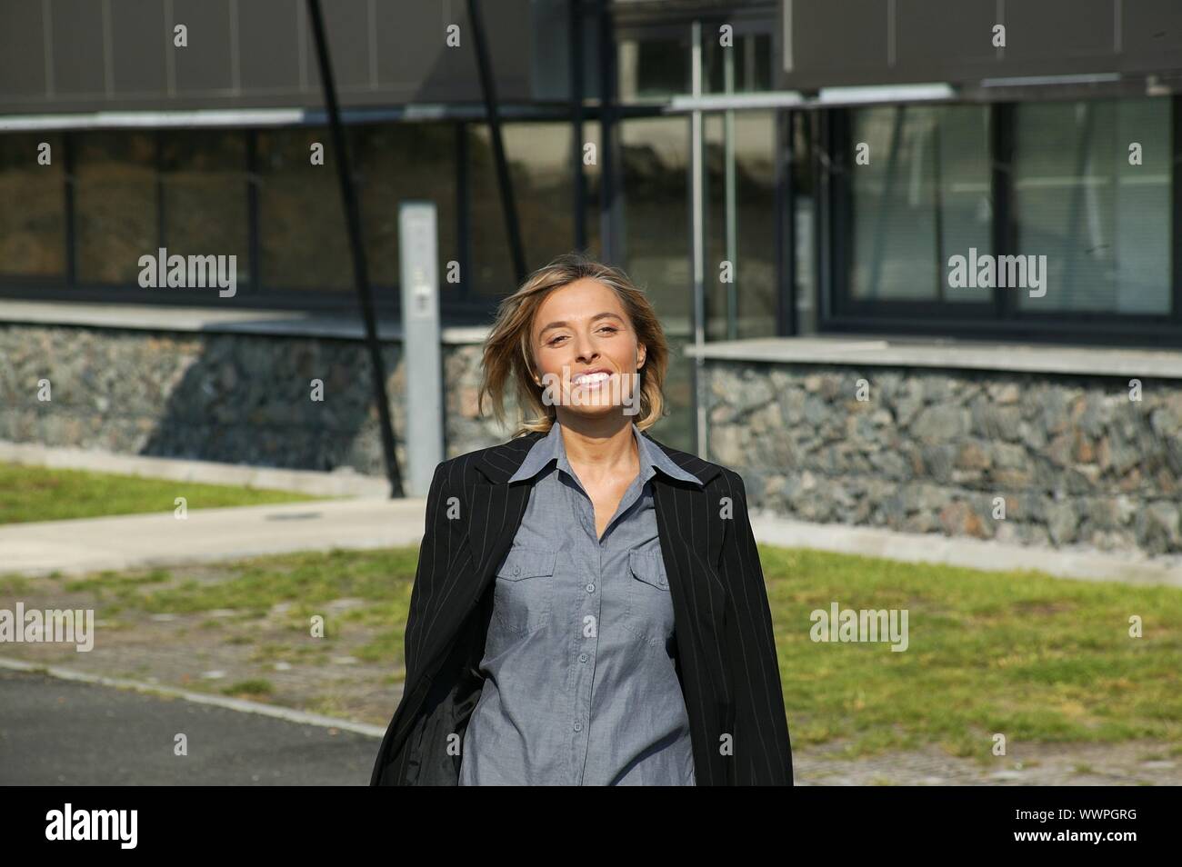 Woman leaving work Stock Photo - Alamy