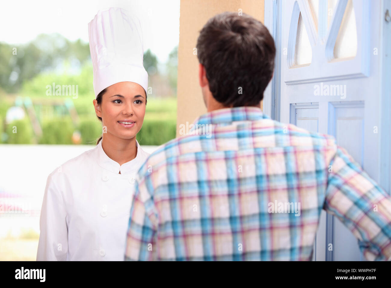 Chef on doorstep Stock Photo - Alamy