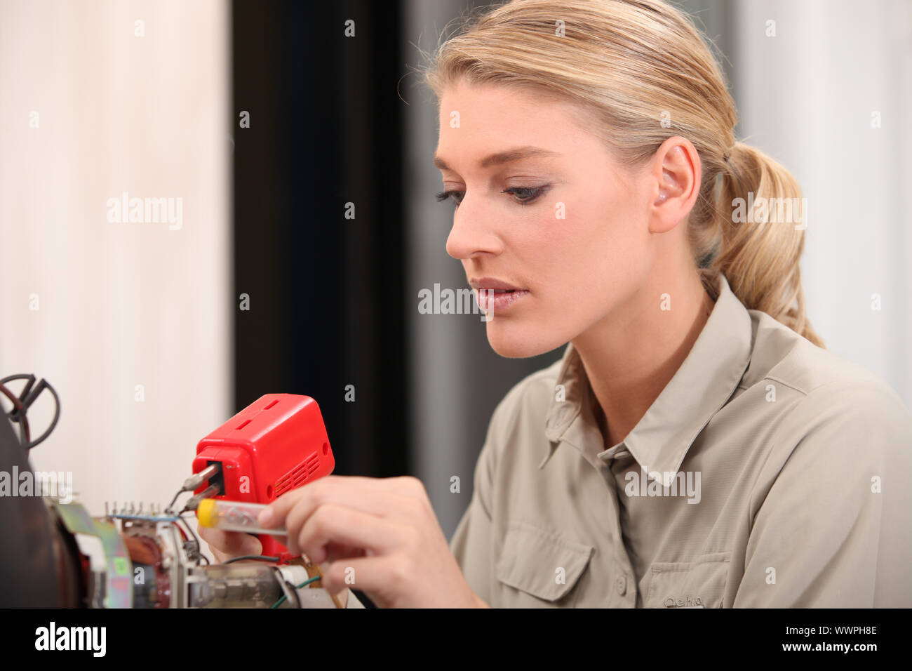 female technician working on an electronic circuit Stock Photo - Alamy