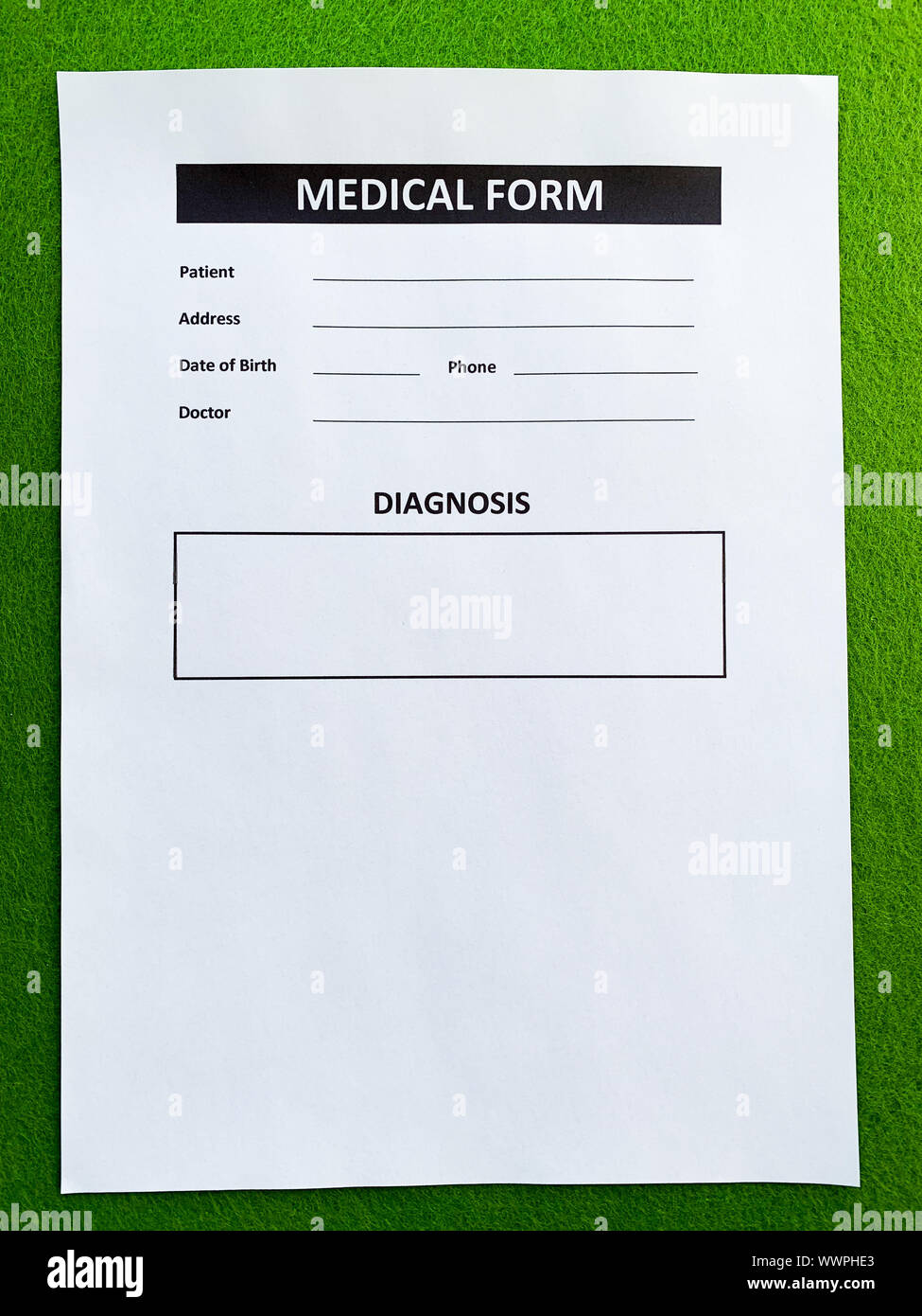 Medical form with patient data on doctor's desk Stock Photo - Alamy
