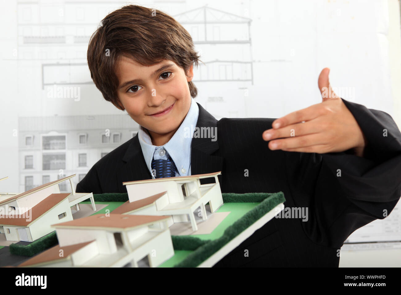 Boy dressed as a businessman in an architect's office Stock Photo - Alamy