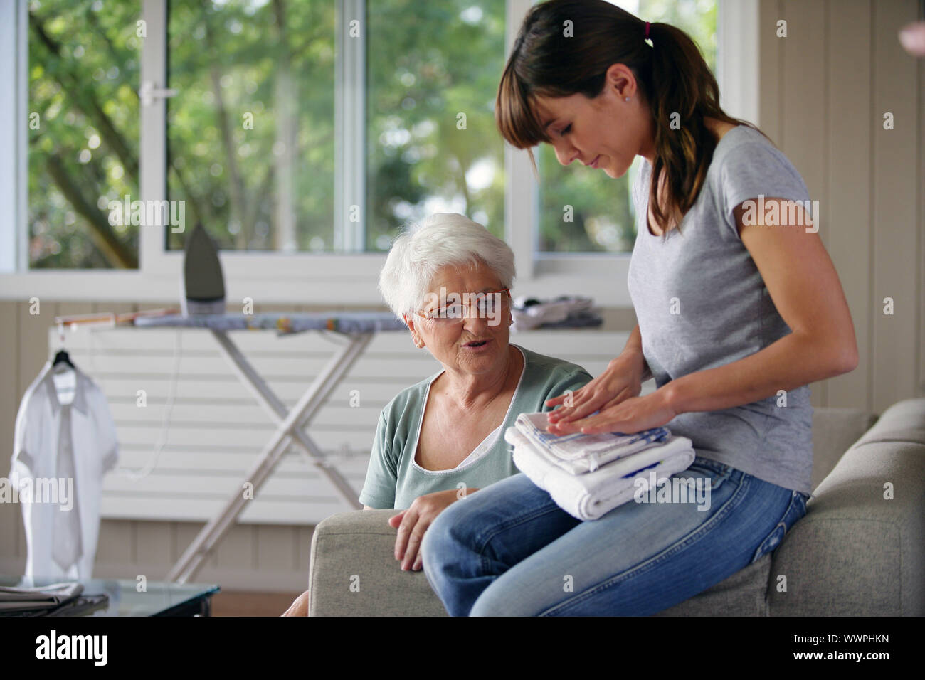 Helping old lady take hi-res stock photography and images - Alamy