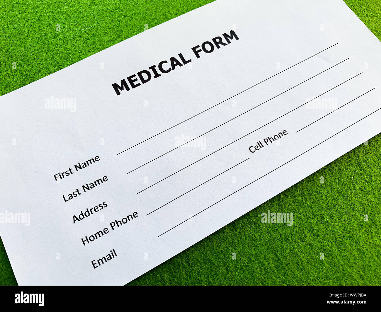 Medical form with patient data on doctor's desk Stock Photo - Alamy