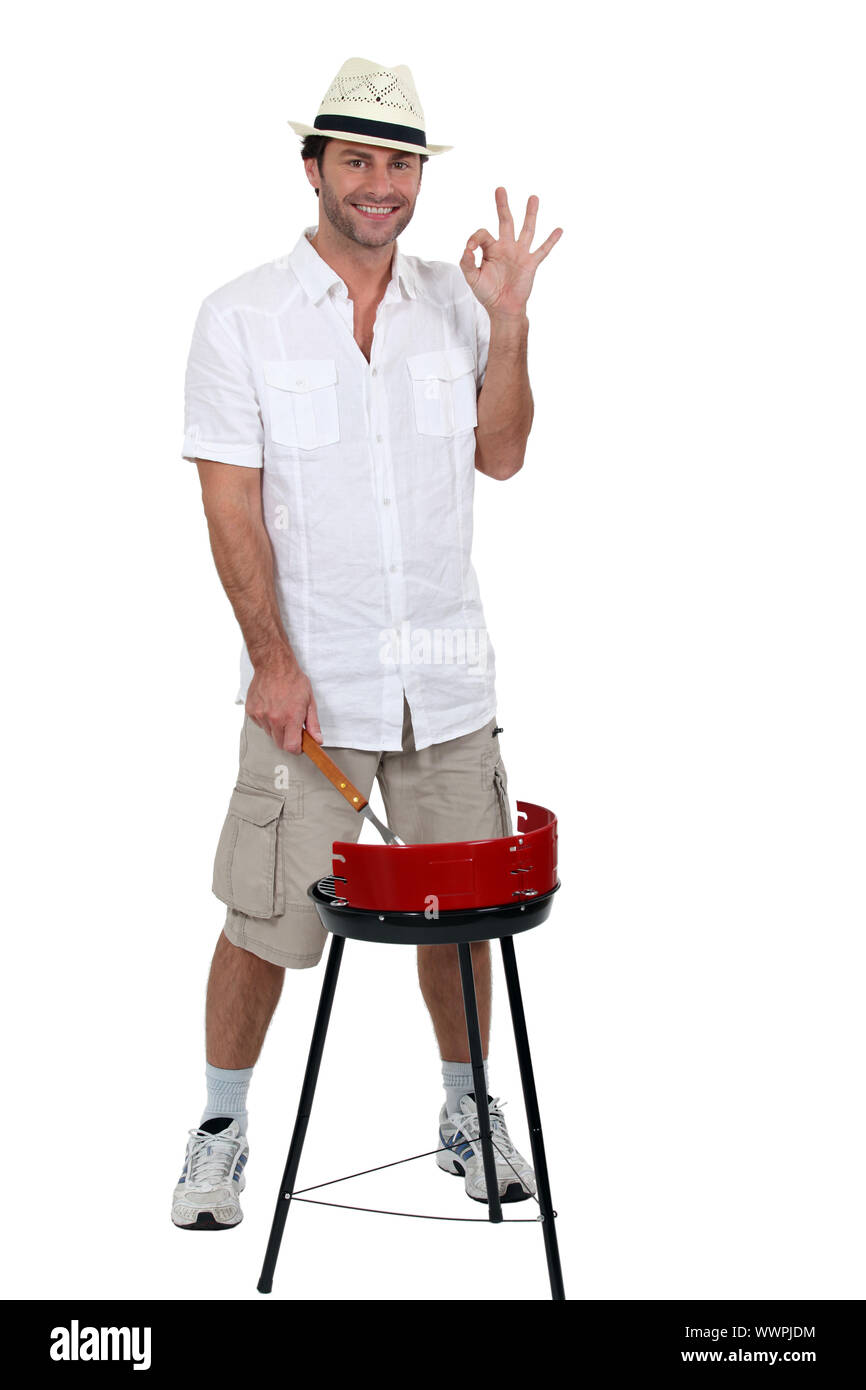 Funny man cooking barbecue Cut Out Stock Images & Pictures - Alamy