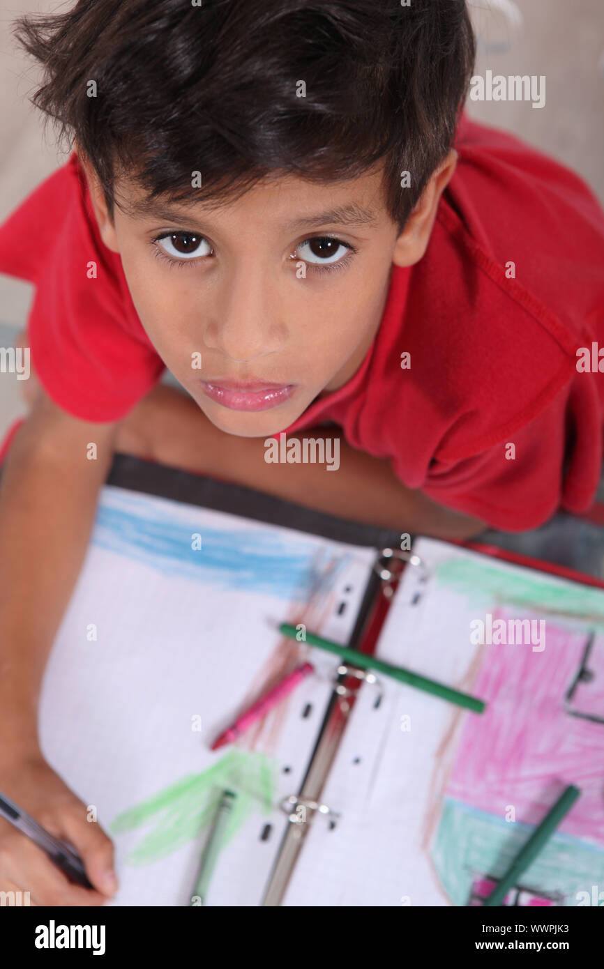 Top-view of bored little boy at school Stock Photo - Alamy