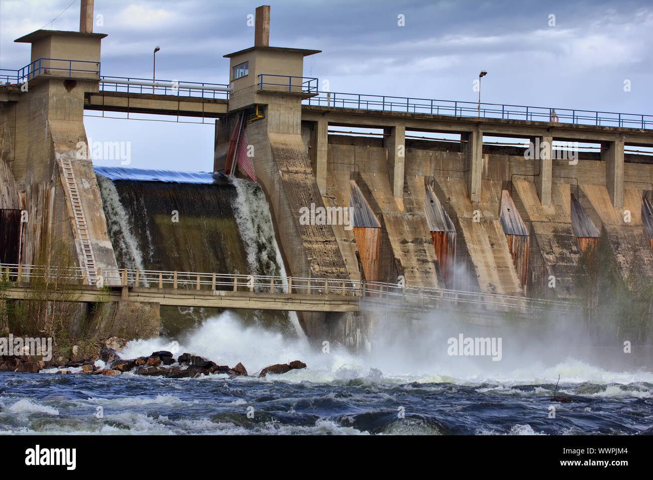 Powerful water discharge through gate of power plant Stock Photo - Alamy