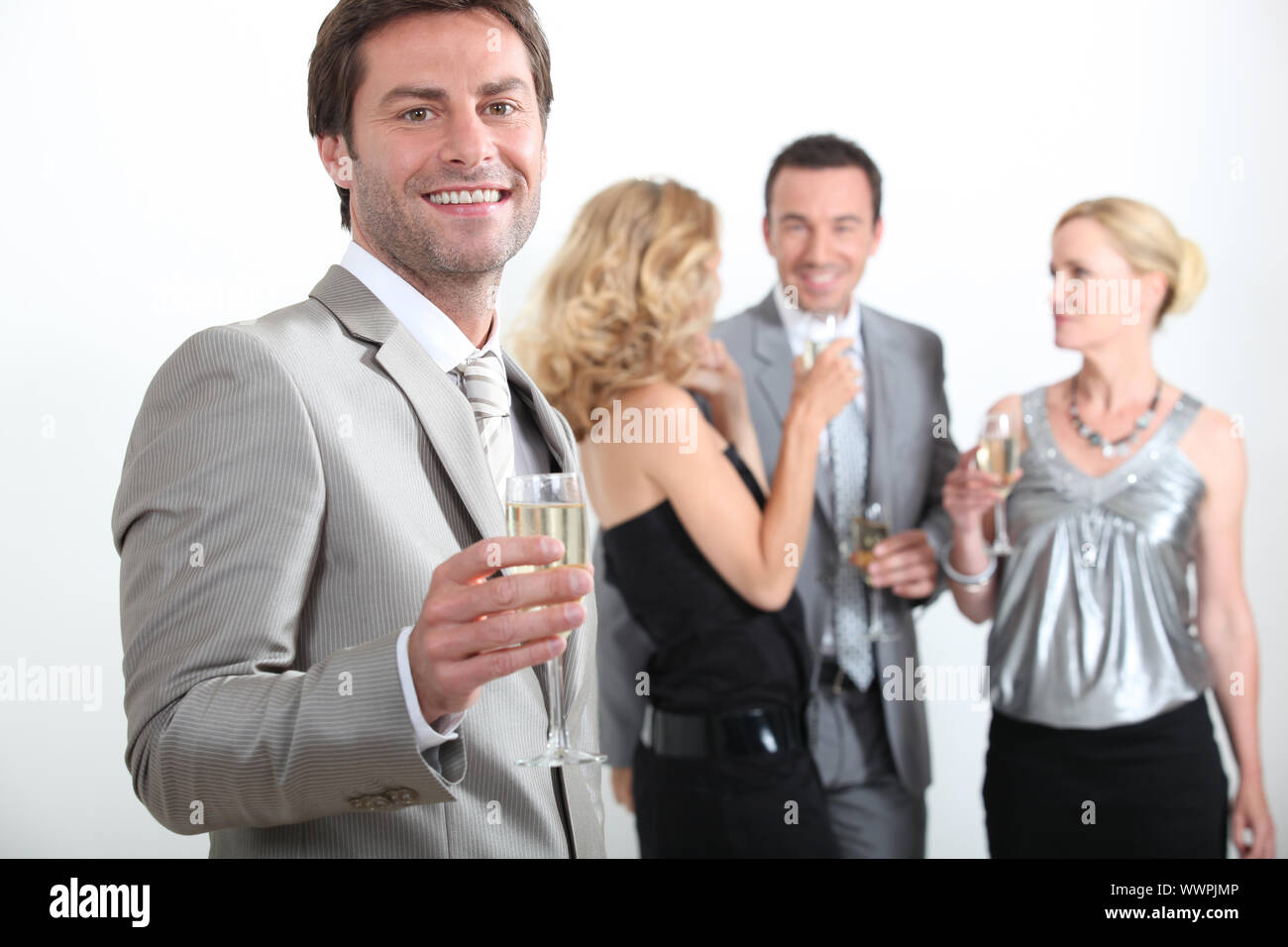 Smart couple toasting standing hi-res stock photography and images - Alamy