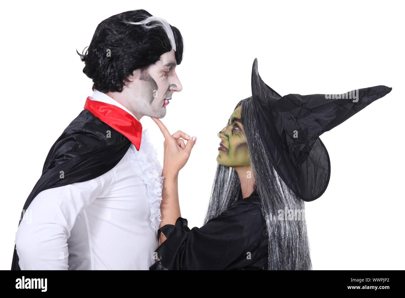Couple dressed as witch and vampire Stock Photo - Alamy