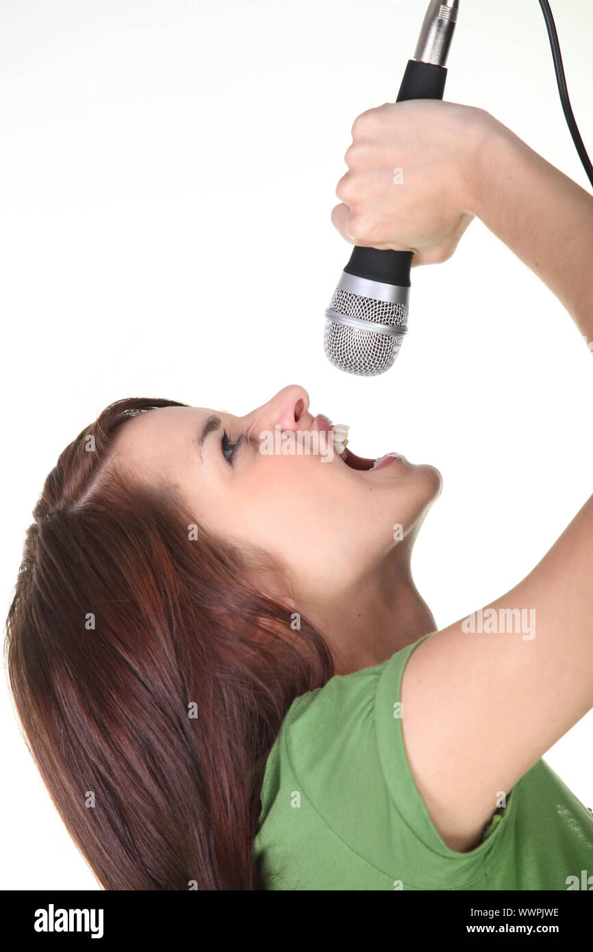 Woman yelling into a microphone Stock Photo - Alamy