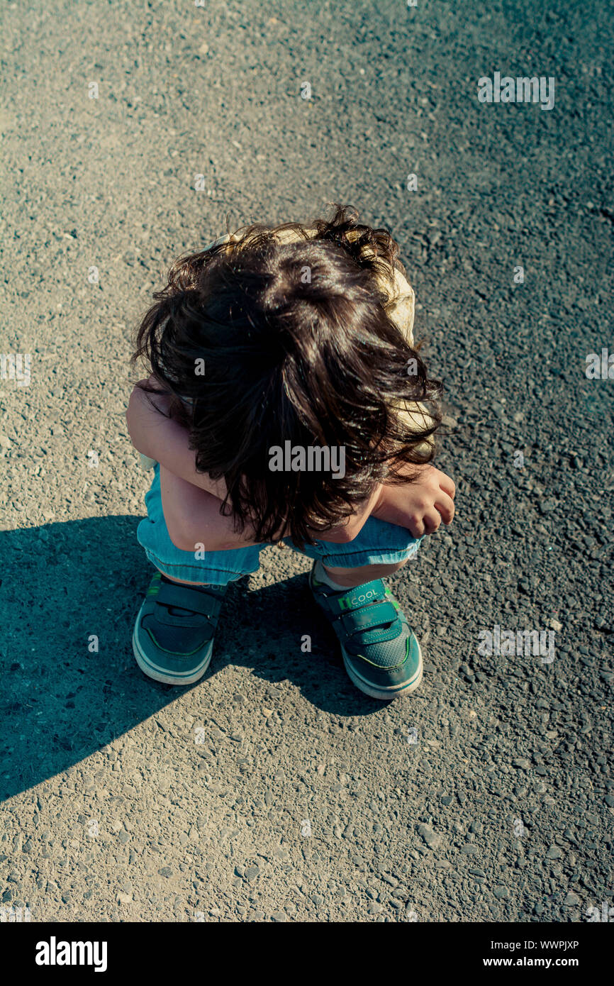 Emotional intelligence and depressed boy looking lonely Stock Photo - Alamy