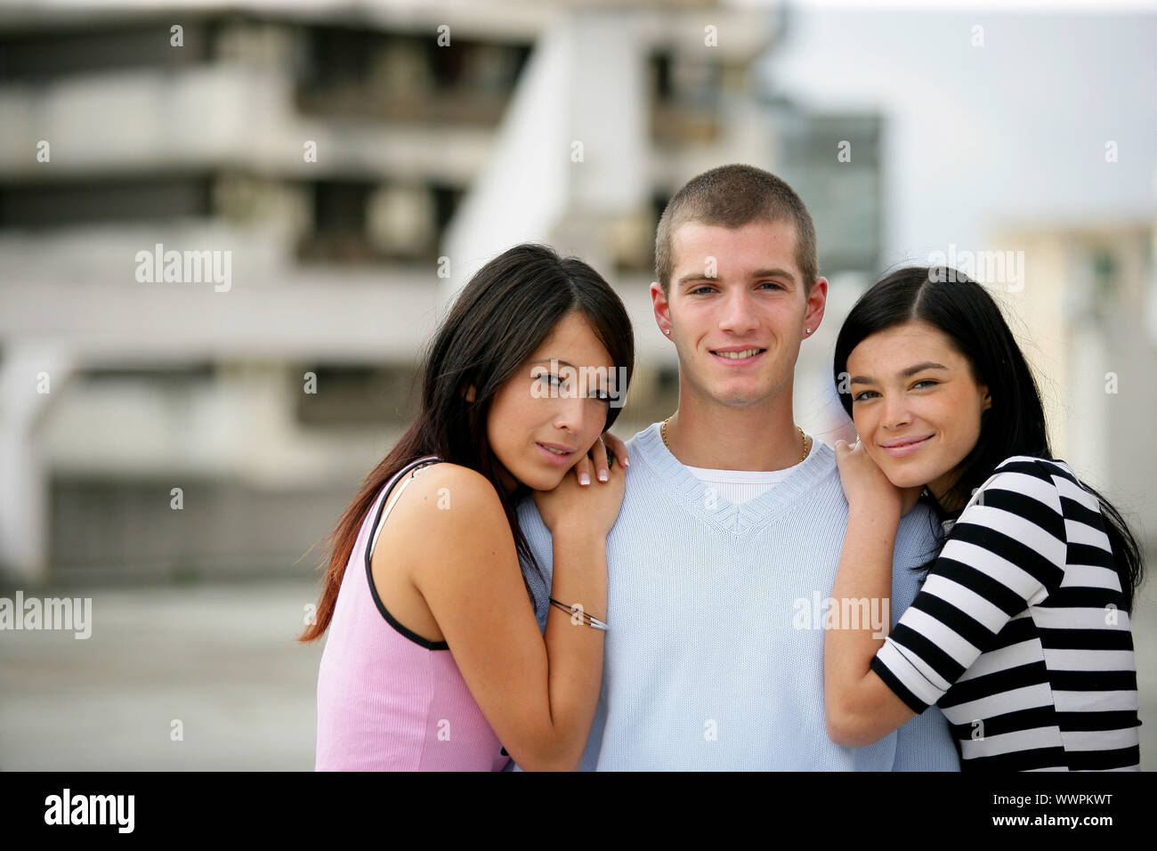 A teenage boy surrounded by girls Stock Photo - Alamy