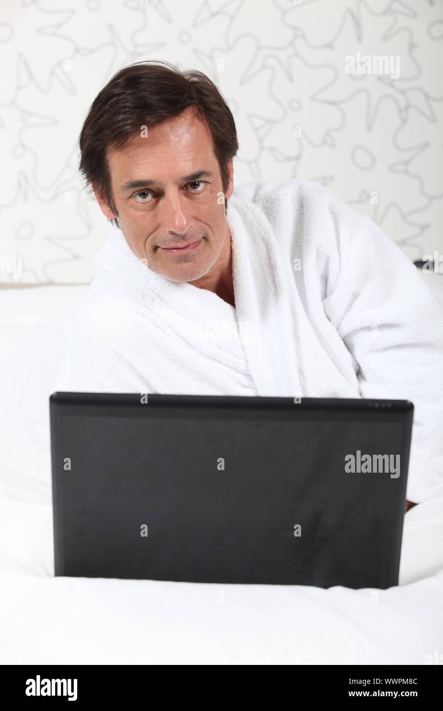 Man in dressing gown working hi-res stock photography and images - Alamy