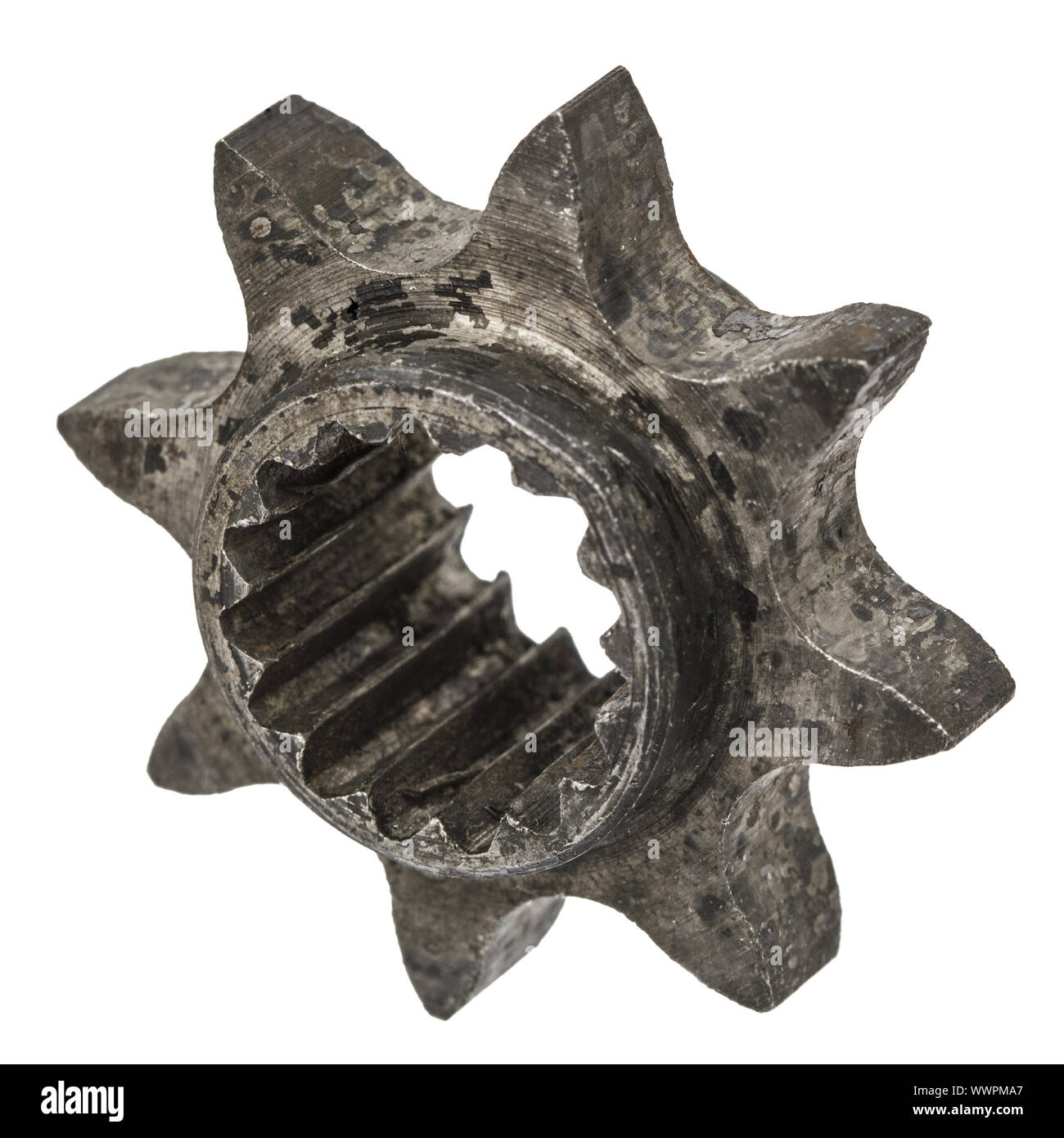 Gear wheel after heat treatment close-up, isolated on a white ...