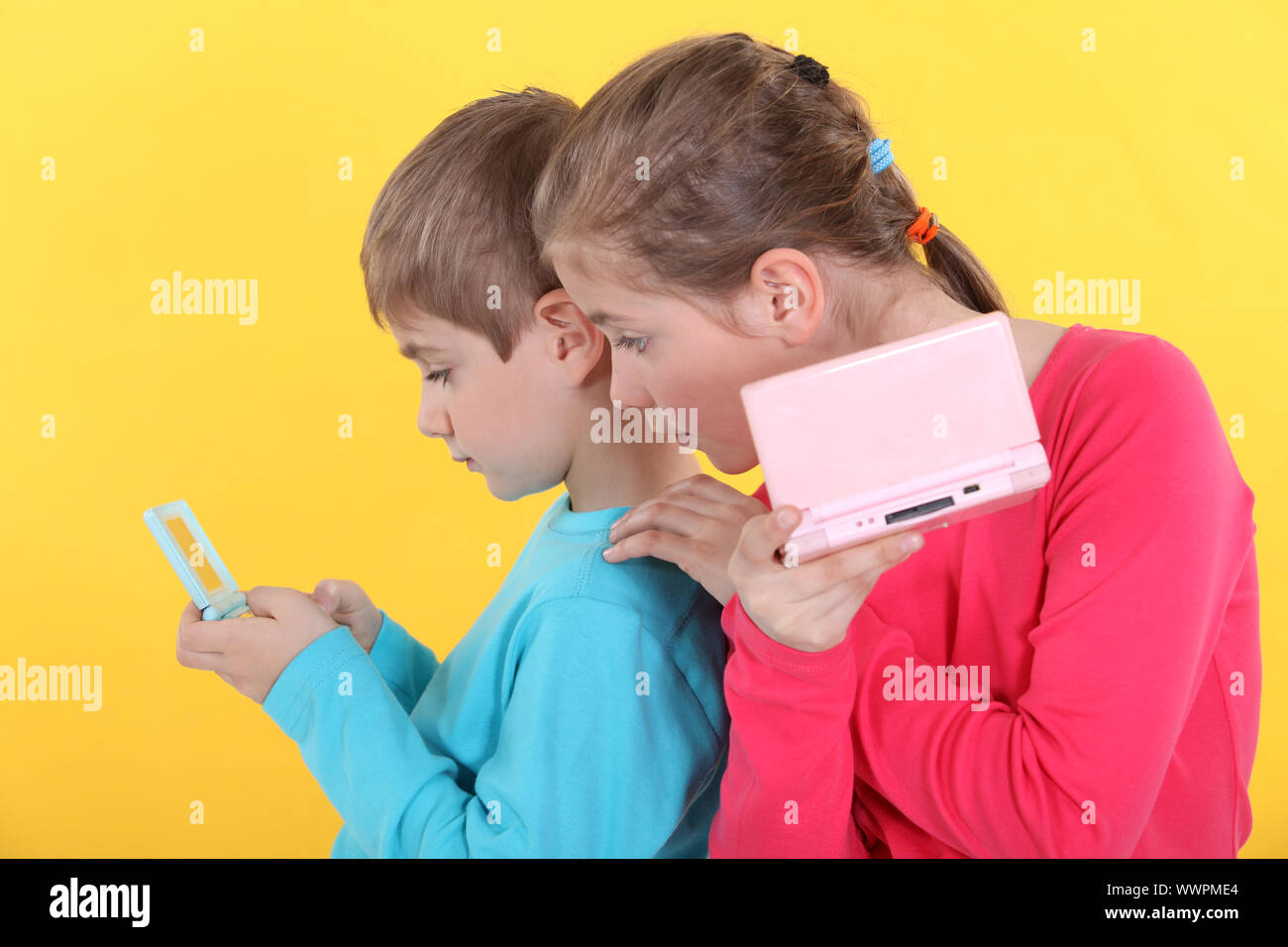 Children with handheld computer games Stock Photo - Alamy