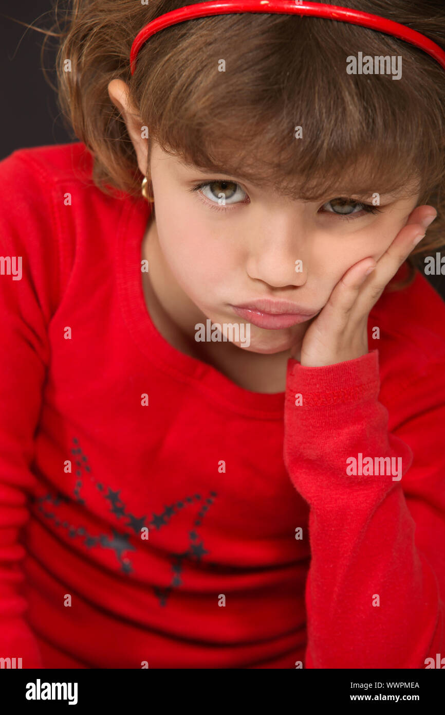 A little girl pouting Stock Photo - Alamy
