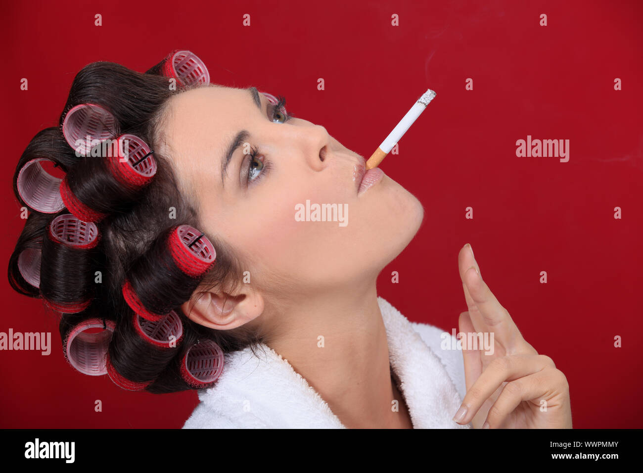 Portrait woman hair curlers smoking hi-res stock photography and images ...
