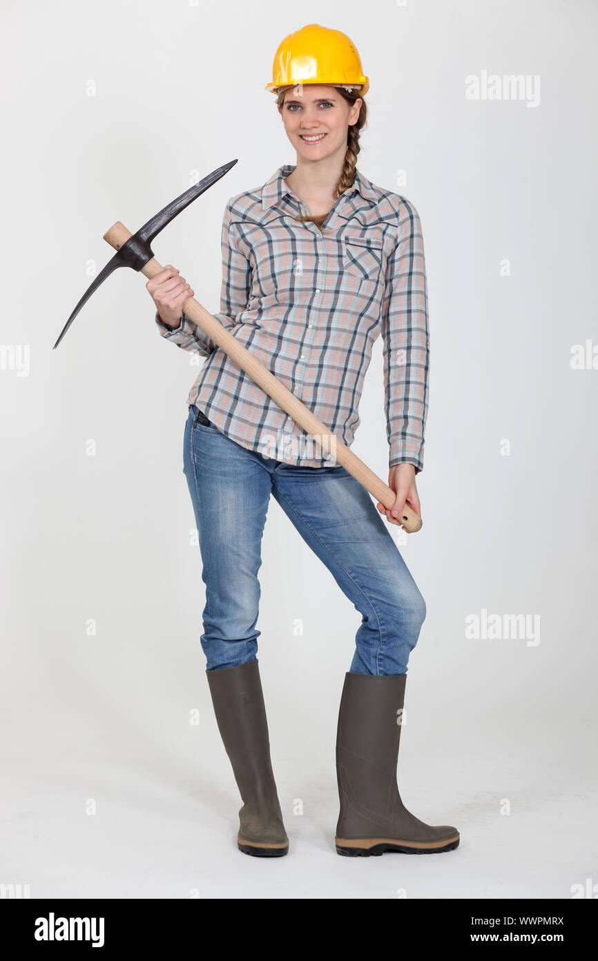 Woman holding pick axe hi-res stock photography and images - Alamy