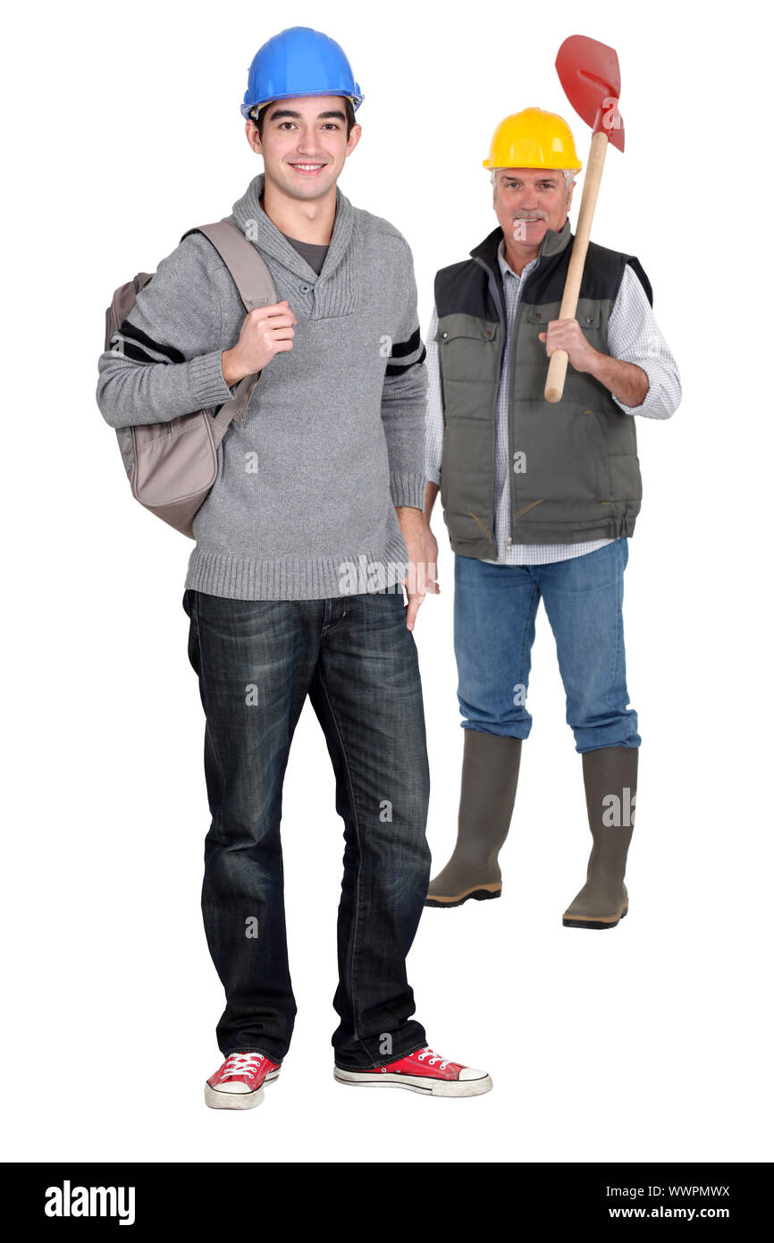 Manual worker with young apprentice Stock Photo - Alamy