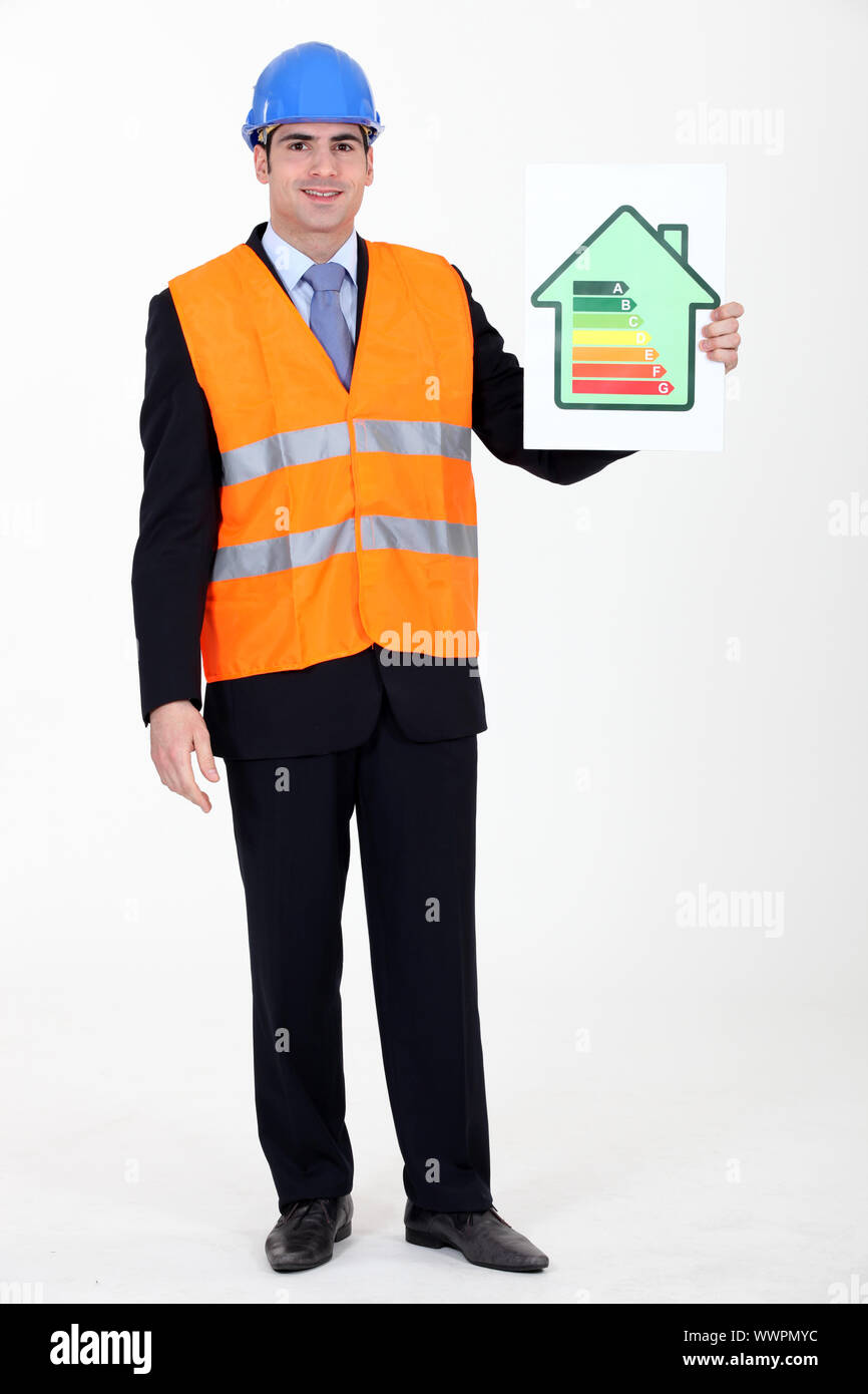 Engineer holding up an energy efficiency rating chart Stock Photo - Alamy