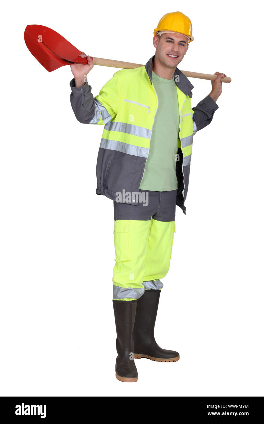 Man holding spade over shoulder Stock Photo - Alamy