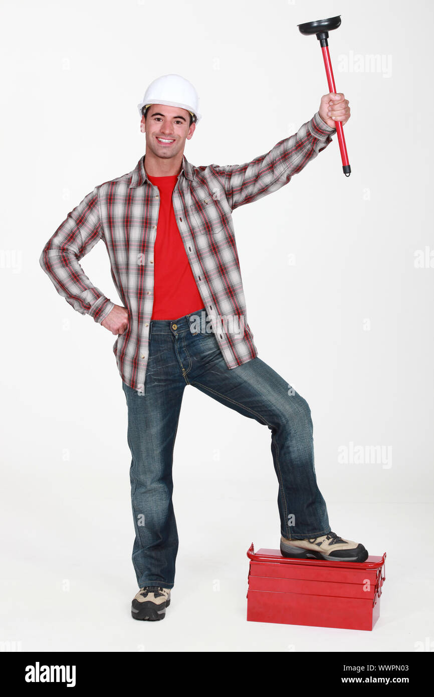 Man with a plunger Stock Photo - Alamy