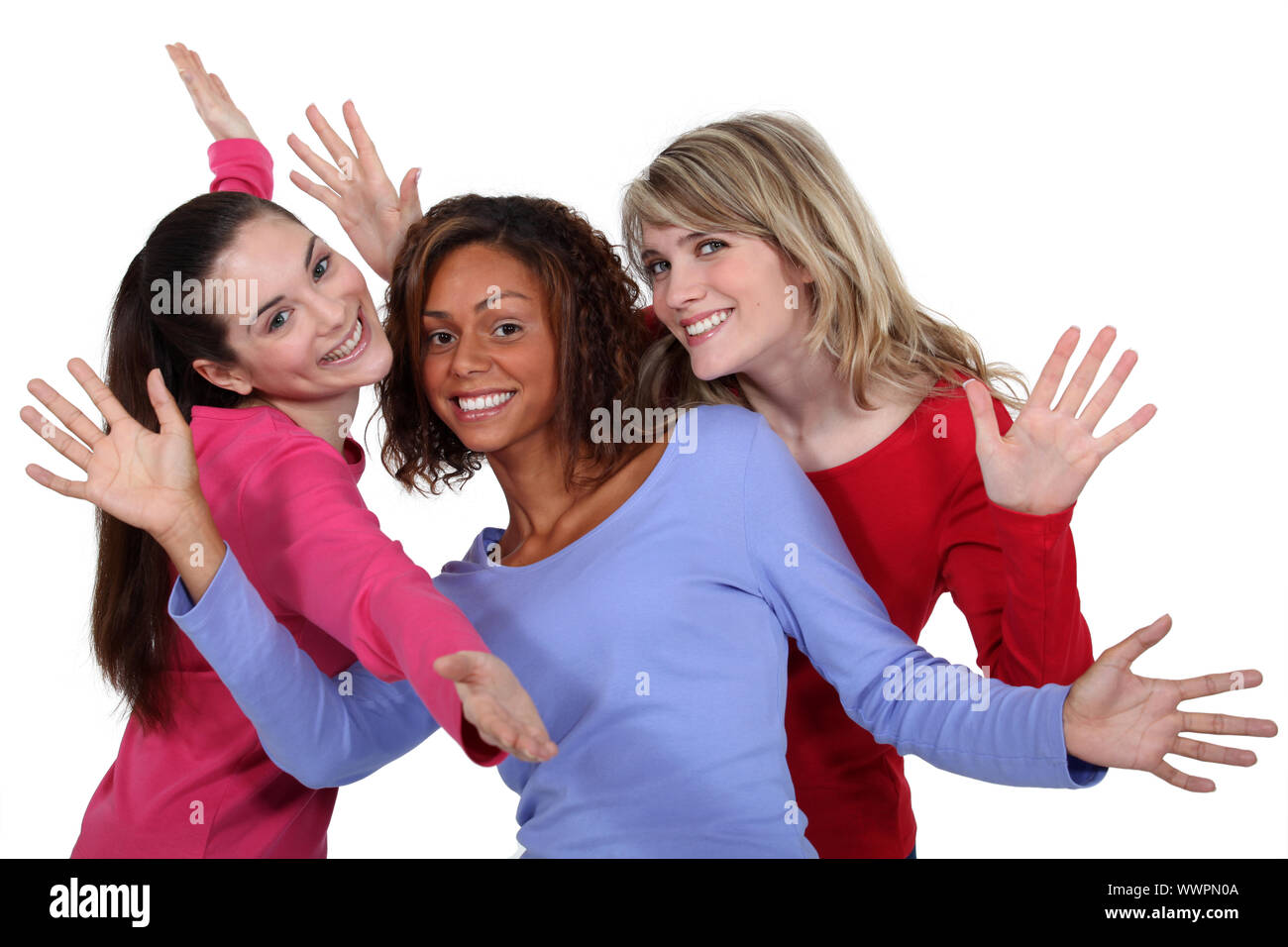 Three friends posing Stock Photo - Alamy