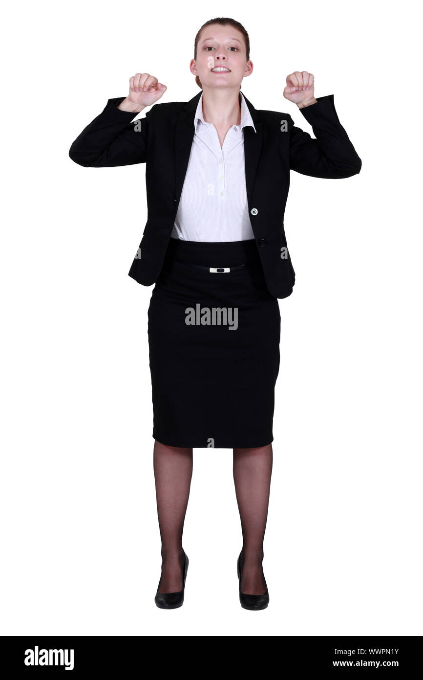 Businesswoman pretending to peer over ledge Stock Photo - Alamy