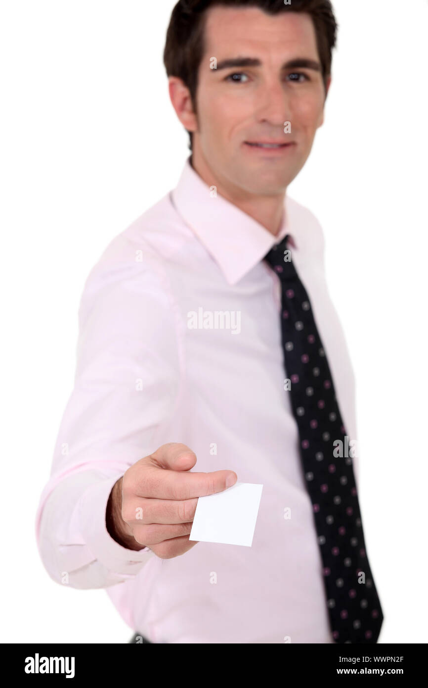 Man holding out his business card Stock Photo - Alamy