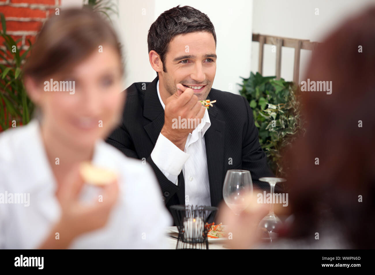 Man eating a meal in a restaurant Stock Photo - Alamy