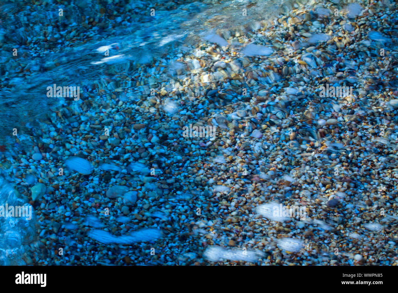 sea pebbles colored granite on the beach background stones. The shore ...