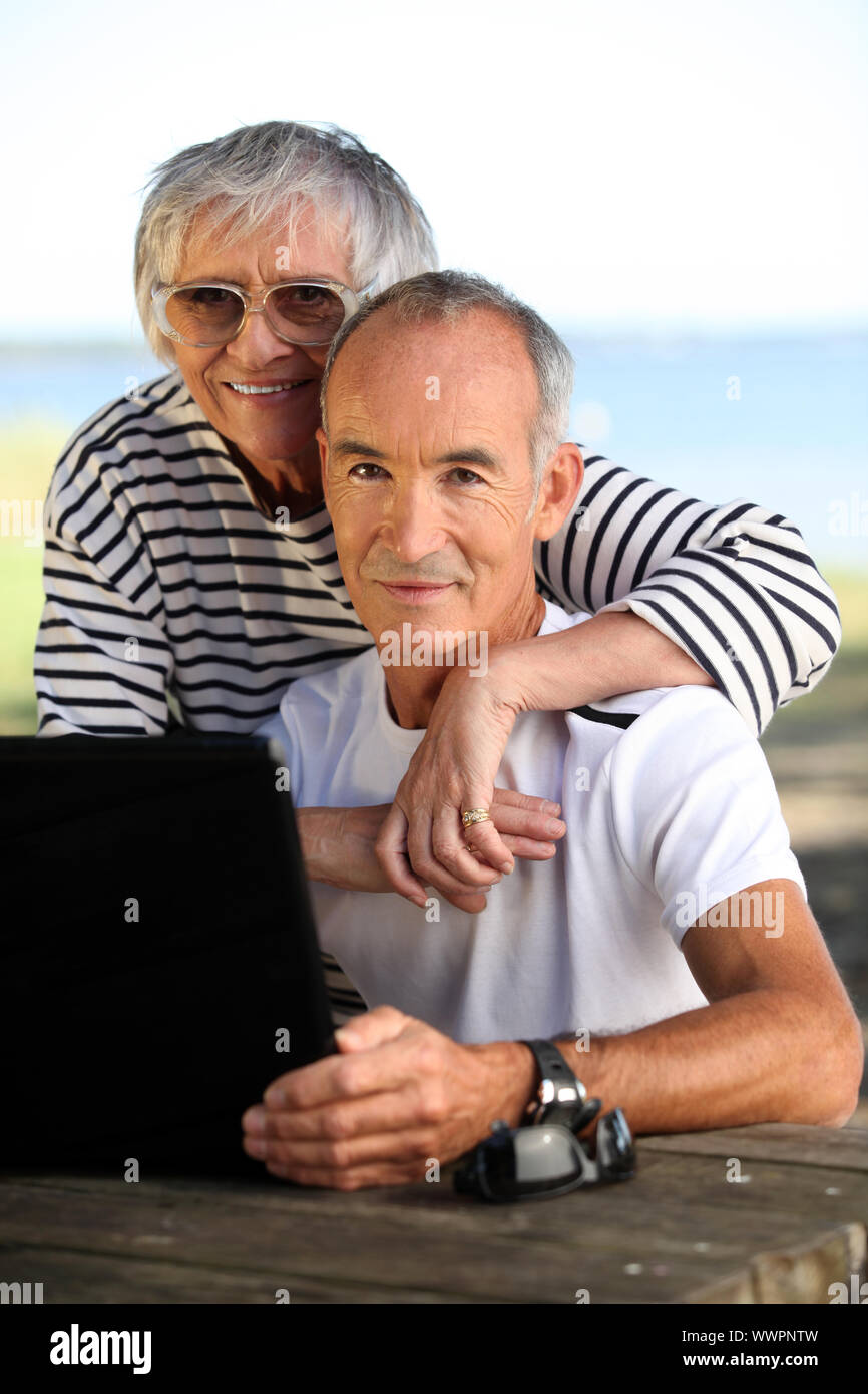 Elderly couple with a computer Stock Photo - Alamy
