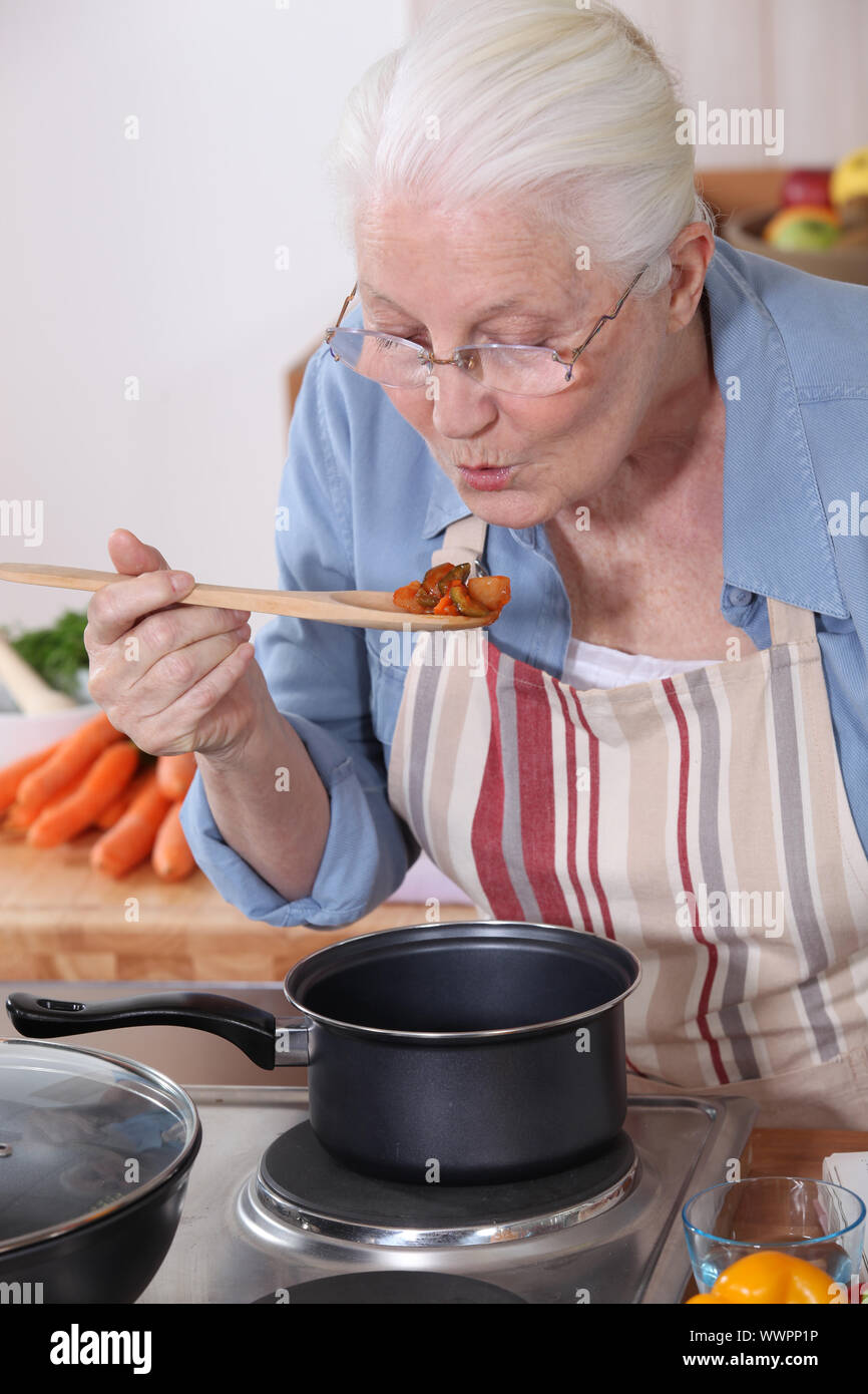 Cooking traditional food grandparent hi-res stock photography and ...