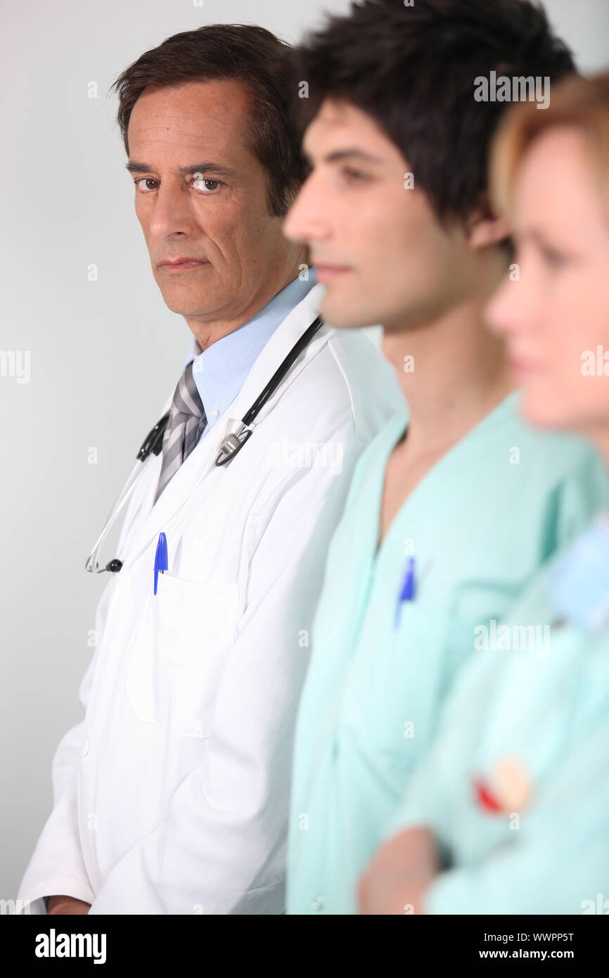 Doctor and nurses in a line Stock Photo - Alamy