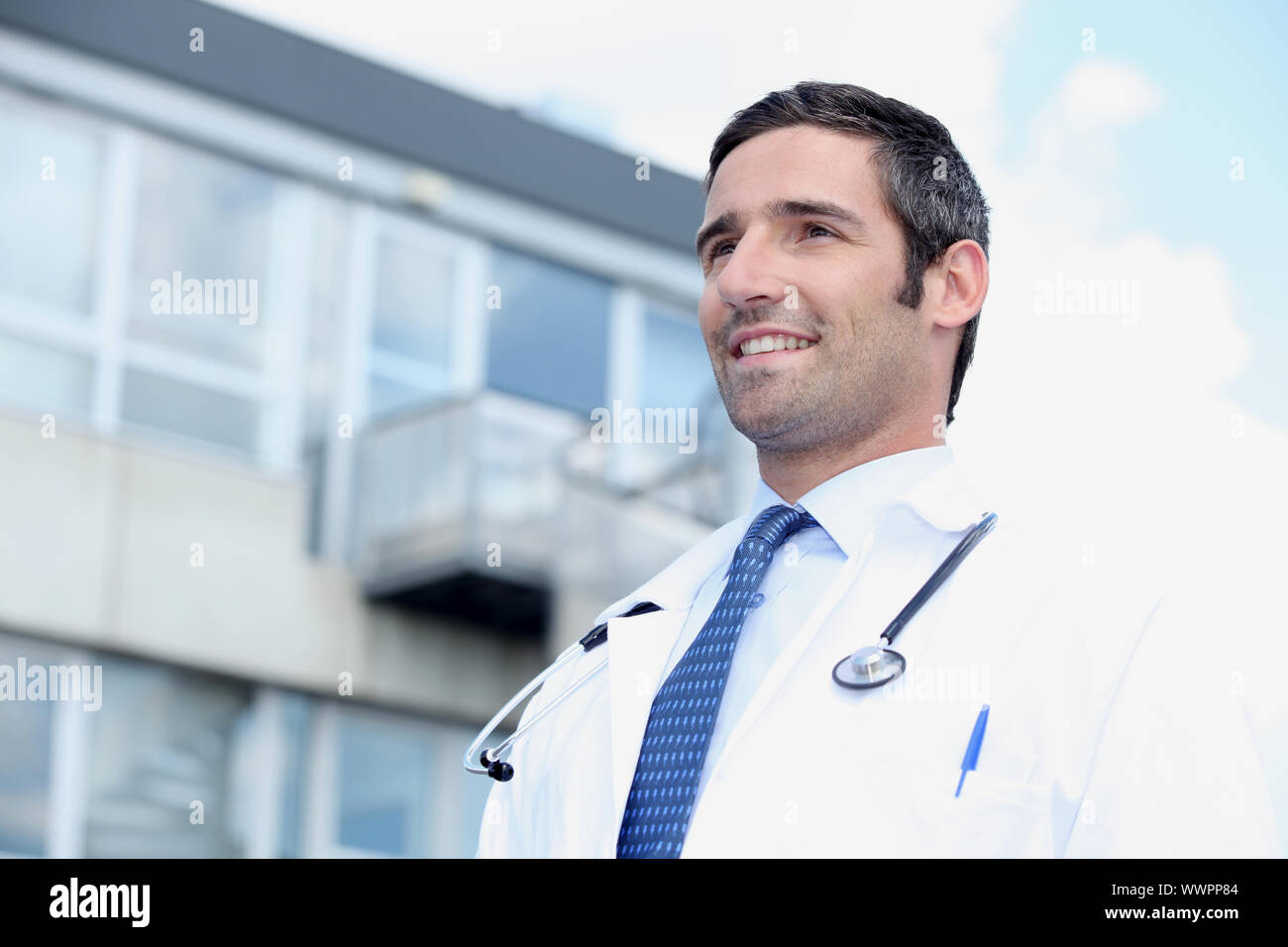 Doctor standing outside Stock Photo - Alamy
