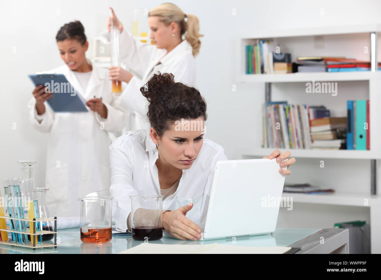 Three scientists in laboratory Stock Photo - Alamy