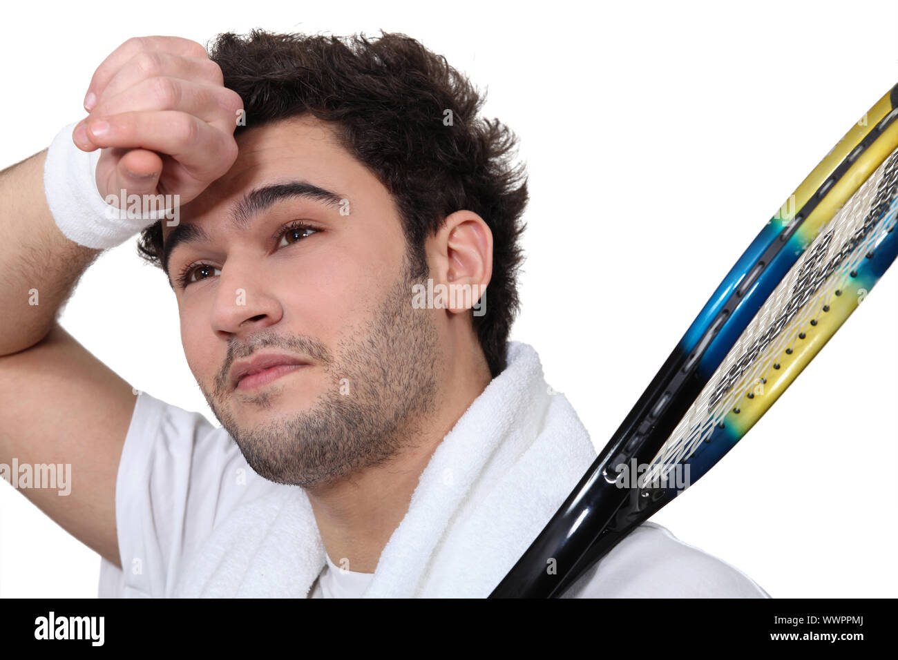 Tennis player wiping the sweat from his brow Stock Photo - Alamy