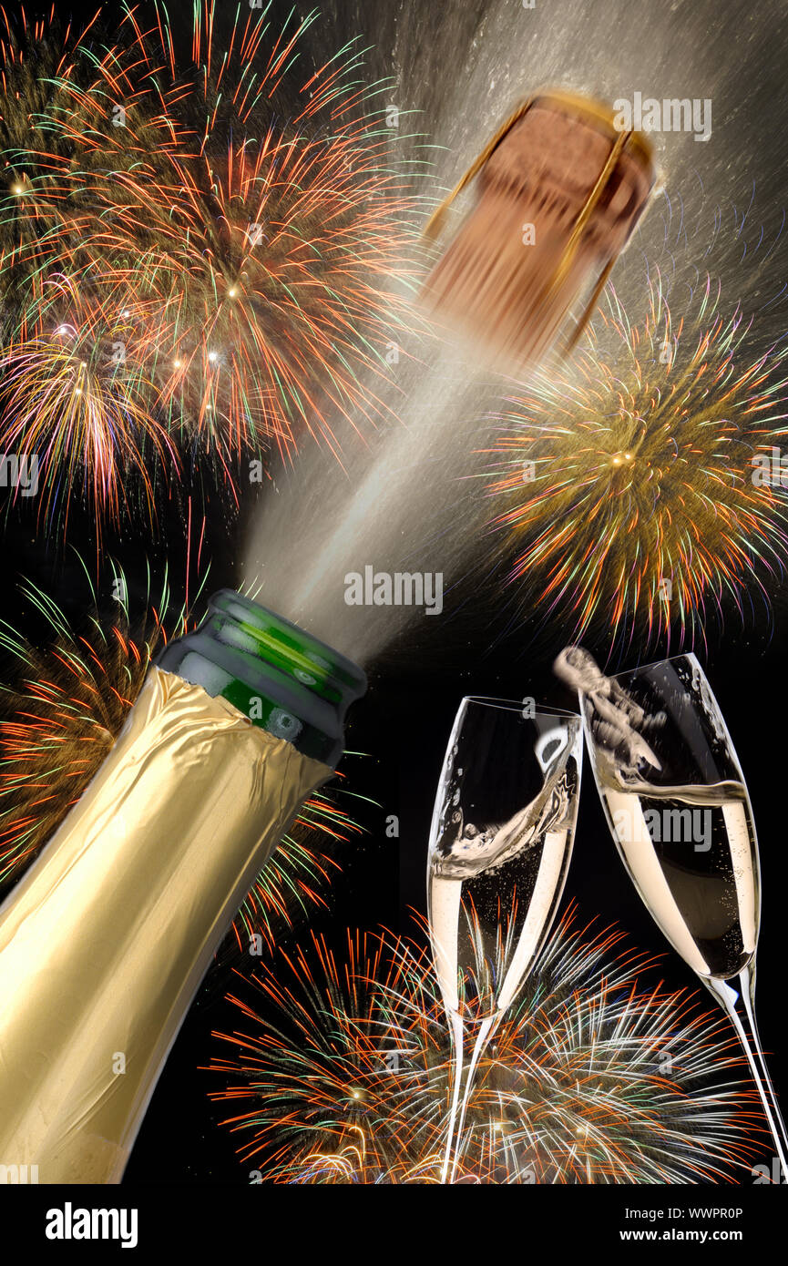 Champagne bottle with popping cork and fireworks Stock Photo - Alamy