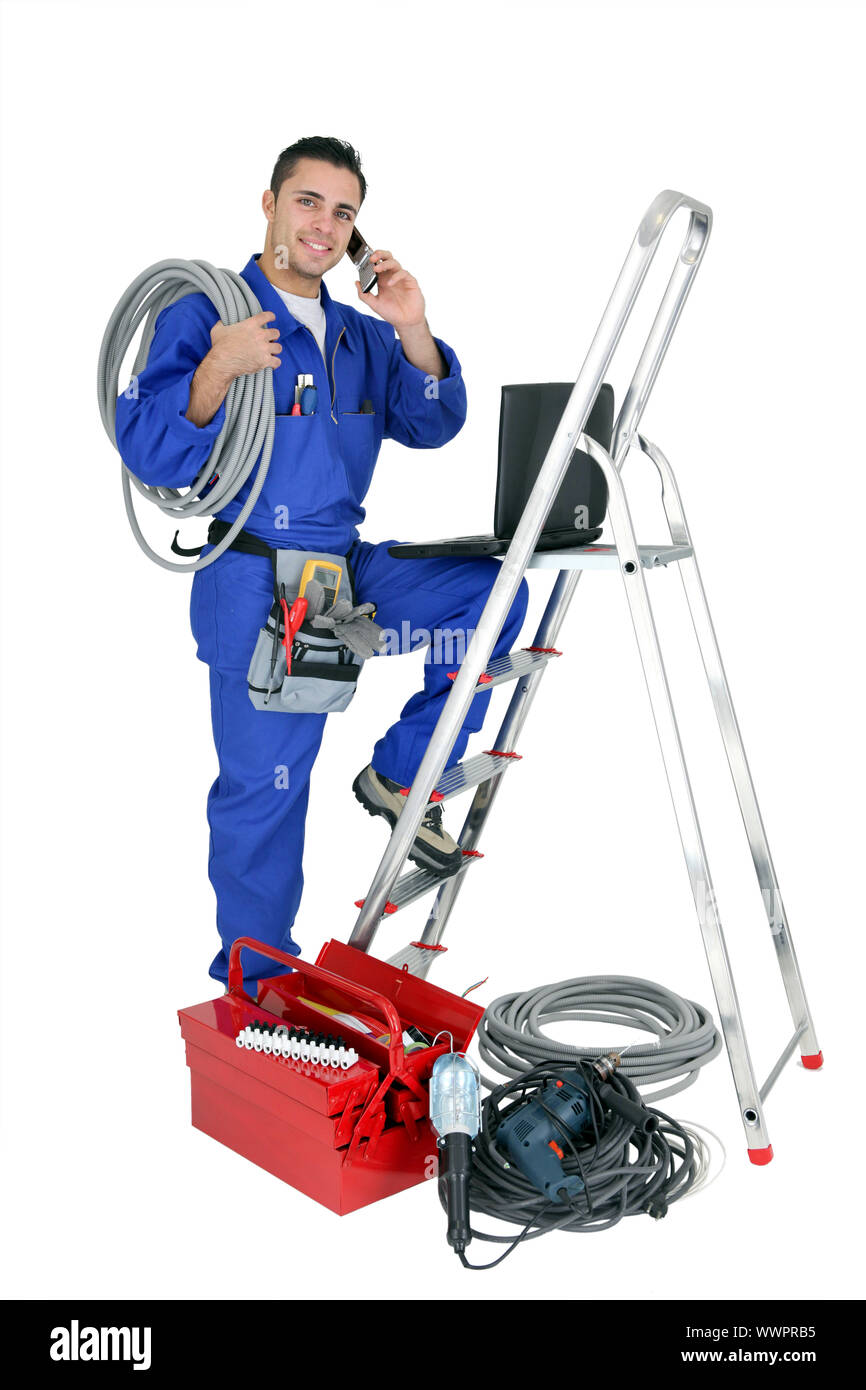 Electrician with mobile telephone Stock Photo - Alamy