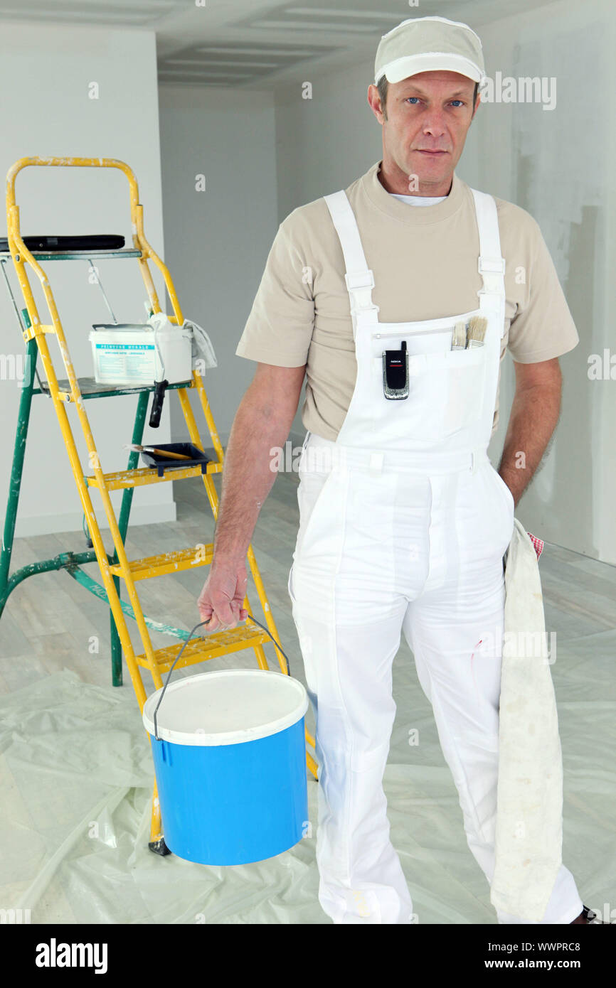 craftsman painting an apartment Stock Photo - Alamy