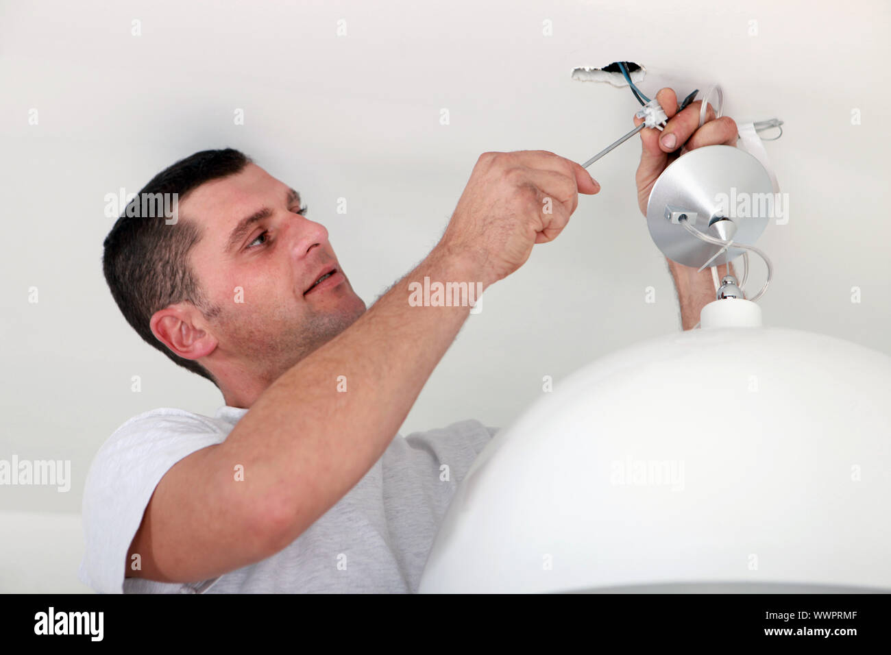 Fixing Light Fitting High Resolution Stock Photography and Images - Alamy