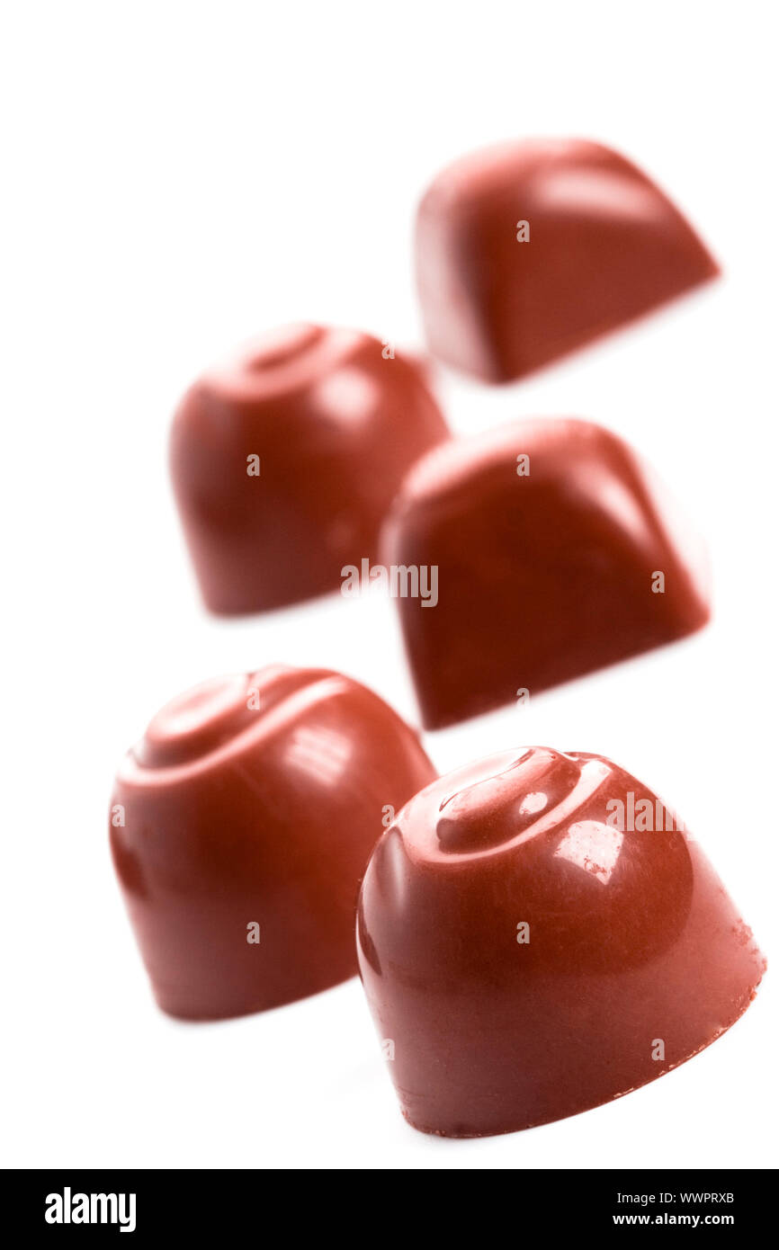 five chocolate sweets isolated on a white background Stock Photo - Alamy