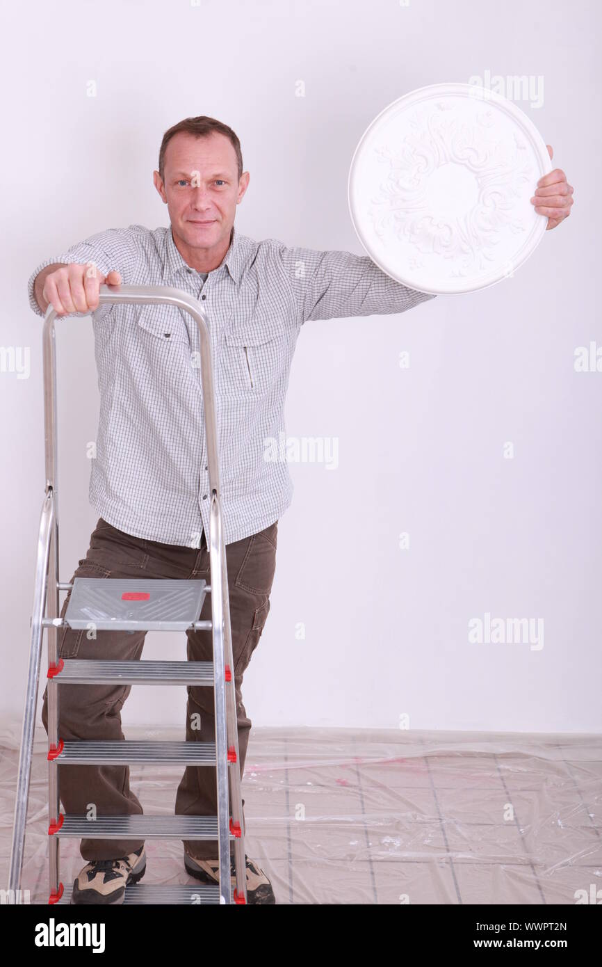 Man climbing step-ladder Stock Photo - Alamy