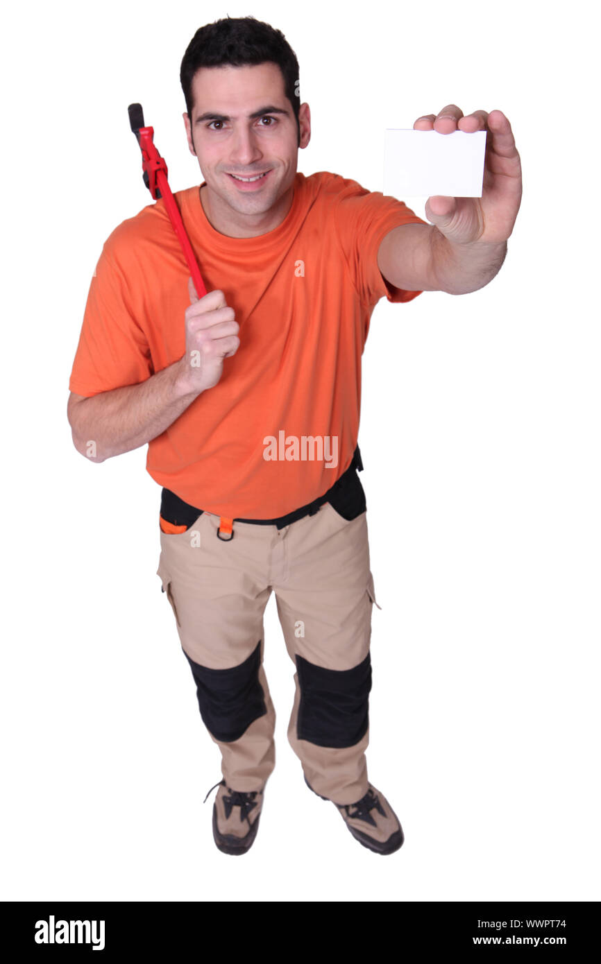 Manual worker holding business card and wrench Stock Photo - Alamy