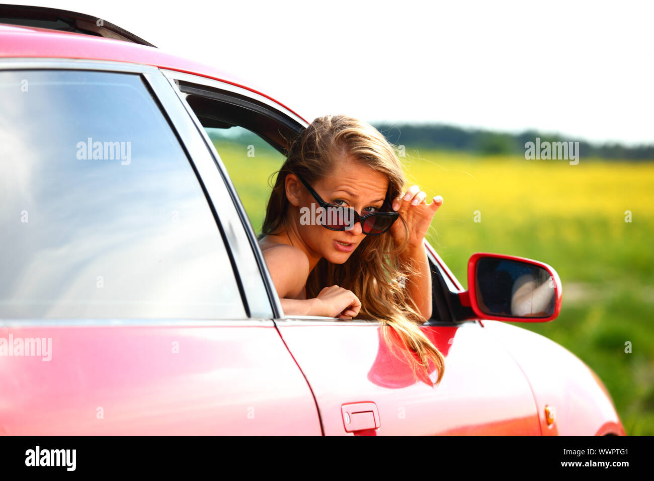 woman in red car Stock Photo - Alamy