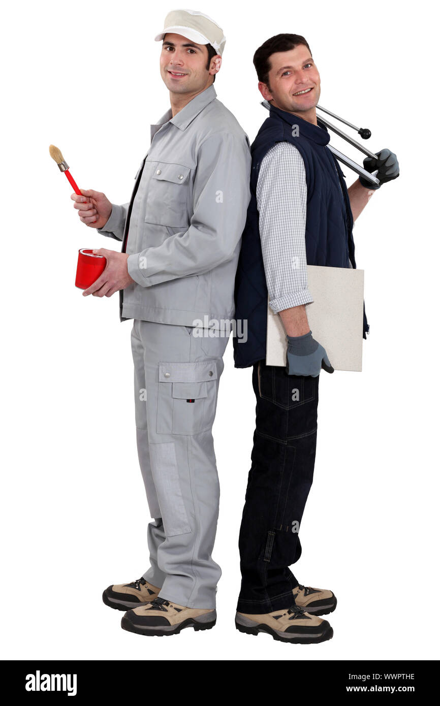 Workers back to back Stock Photo - Alamy